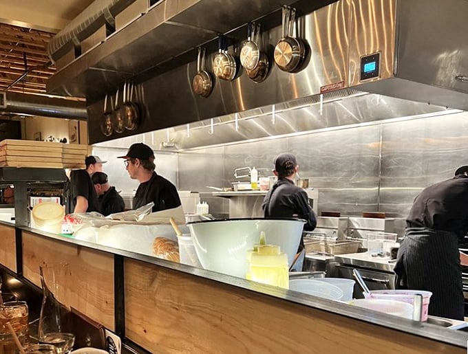 Where the magic happens. The open kitchen gives diners a front-row seat to culinary craftsmanship in action.