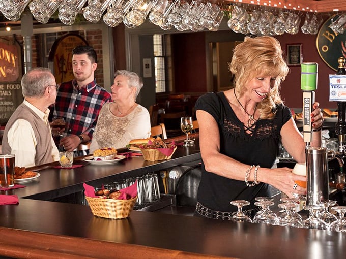 The bar scene at Fireside Tavern—where everybody might not know your name yet, but they'll remember your favorite drink by visit two.