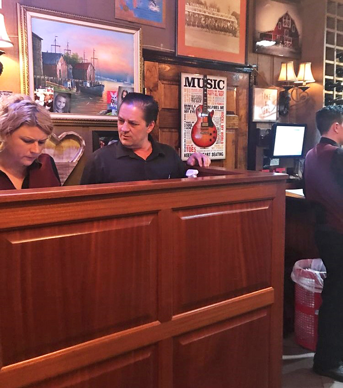 The host stand—where dreams of prime rib begin and where regulars are greeted like returning heroes.