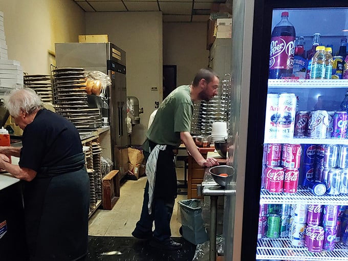 Behind-the-scenes magic where pizza dreams come true. Like watching artisans at work, these kitchen wizards transform simple ingredients into edible masterpieces.