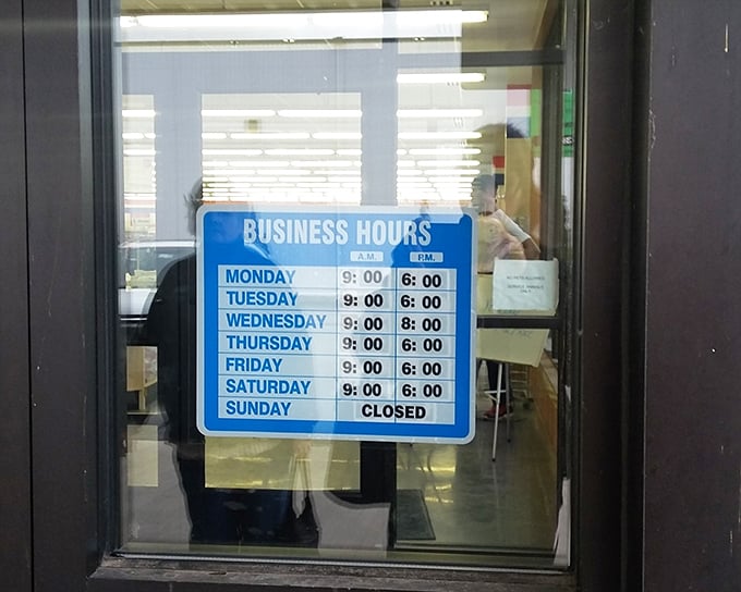 The store hours sign promises six days of treasure hunting weekly. Like a roadmap to bargain paradise, it guides shoppers to plan their adventures.