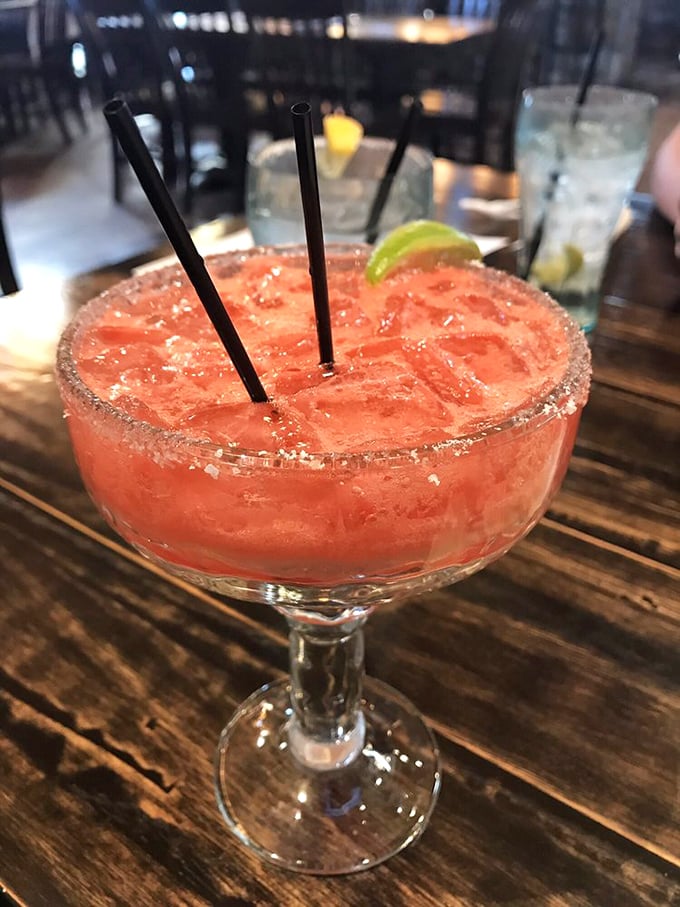 This strawberry margarita isn't just a drink, it's a vacation in stemware—complete with salt-rimmed passport control.