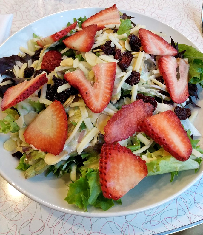 A strawberry salad that brings together nature's candy with cheese and greens—proof that healthy eating needn't be punishment.