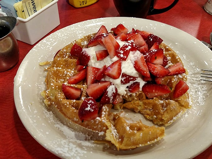 A waffle that's dressed for success with strawberries and whipped cream. Breakfast or dessert? Why choose when you can have both?