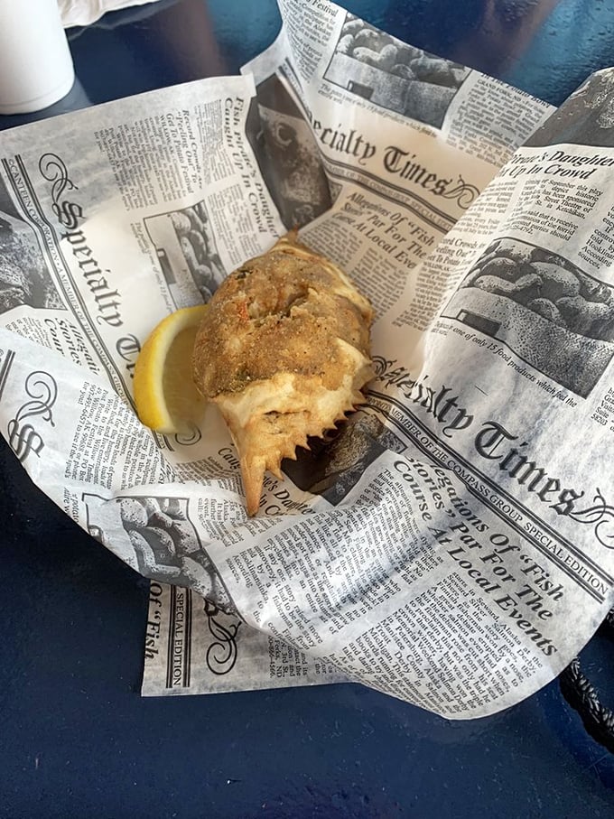 The stuffed blue crab arrives on newspaper like a delicious time capsule from Old Florida. This isn't just food—it's edible coastal heritage.