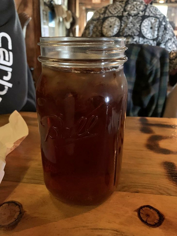 Sweet tea served in a proper Mason jar—because when you're this far from civilization, hydration comes with a side of nostalgia.