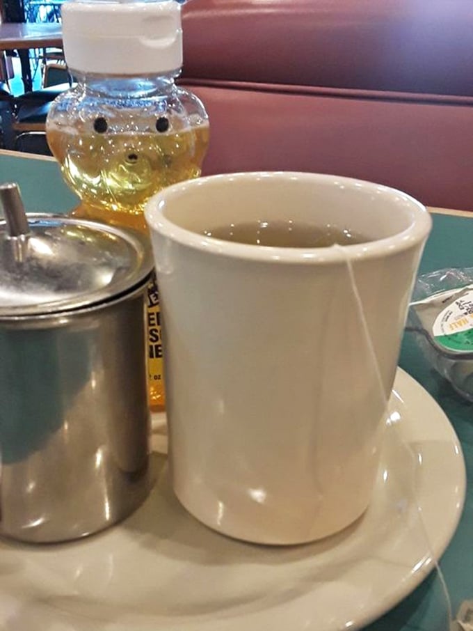 The classic diner mug of tea, sitting patiently beside honey in a bear bottle—a duo as timeless as Sonny and Cher.
