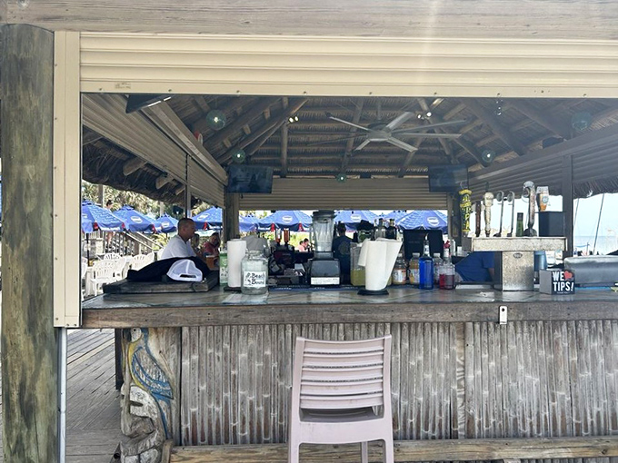 The tiki bar where memories are made—corrugated metal, weathered wood, and bartenders who've heard every fishing story twice.