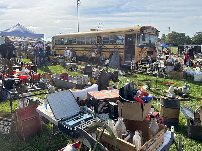 The yellow school bus isn't for kids anymore—it's a mobile treasure trove surrounded by typewriters, bottles, and curiosities from America's attic.
