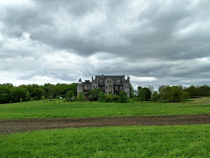 From across the fields, RavenStone appears like a mirage—a stone fortress rising improbably from farmland under dramatic Midwestern skies.
