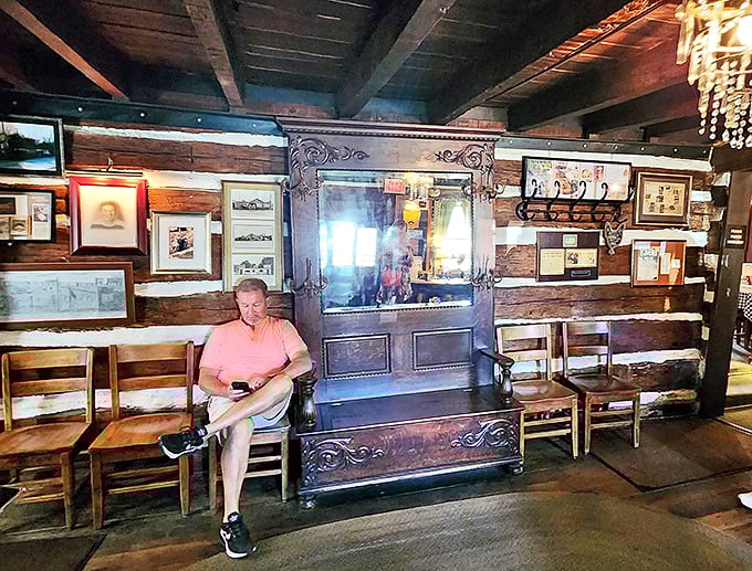 The waiting area doubles as a living museum of Stroud's history. Those wooden chairs have supported countless hungry patrons over the years.