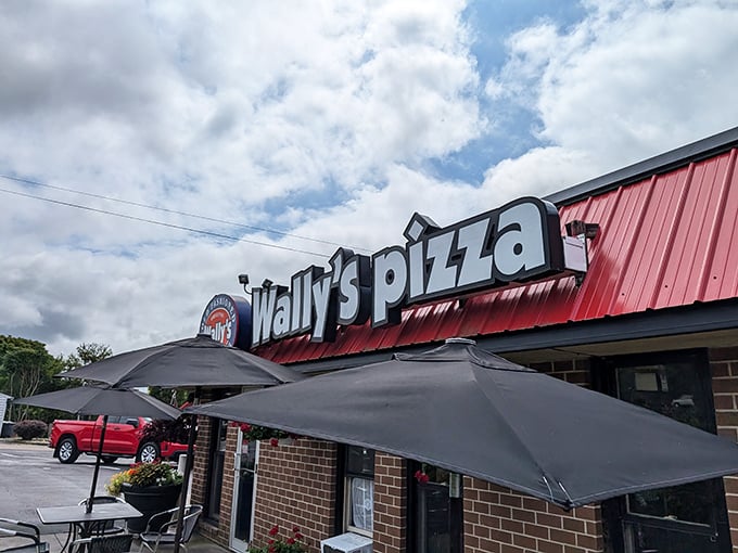 Wally's Pizza—where the red roof promises comfort food that won't judge you for ordering extra cheese, and neither will we.