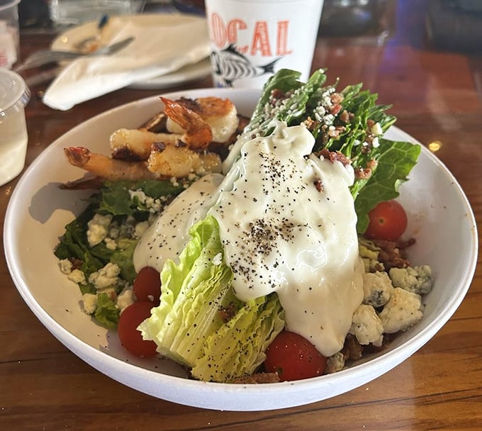 A wedge salad that proves vegetables can be exciting when they're dressed properly – like the seafood equivalent of a black-tie event.