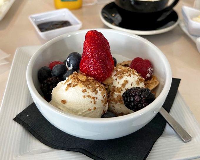 A bowl of yogurt that looks like it's dressed for a berry beautiful gala. Breakfast that's both virtuous and indulgent—the Swedish way.