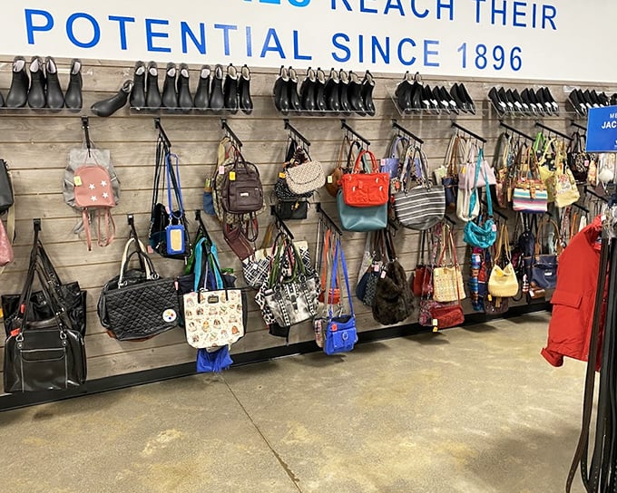 The handbag wall showcases a rainbow of purses and totes—each one previously loved but ready for new adventures on someone else's arm.