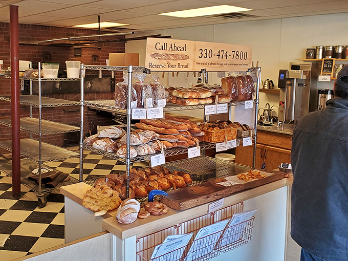 This isn't just a display case—it's a treasure chest of carbohydrate jewels. Each loaf and pastry waits patiently for its forever home.