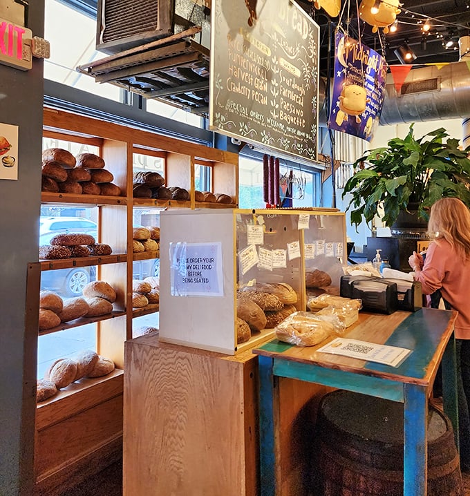 The bread display—where carb dreams come true and diet plans go to die, gloriously and without regret.