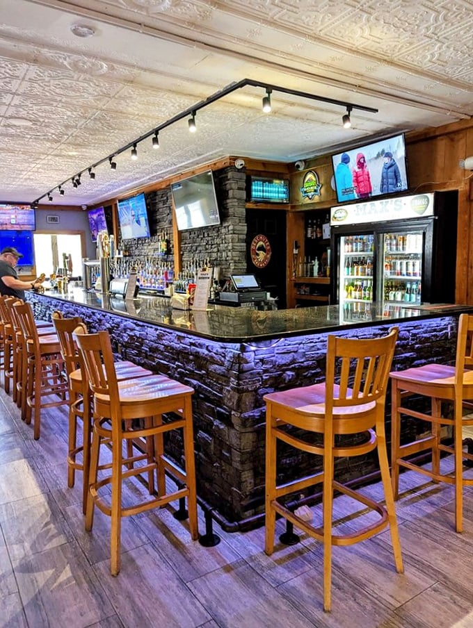 The bar where everybody might not know your name yet, but they'll remember your drink order. That purple lighting isn't just cool – it's strategic.