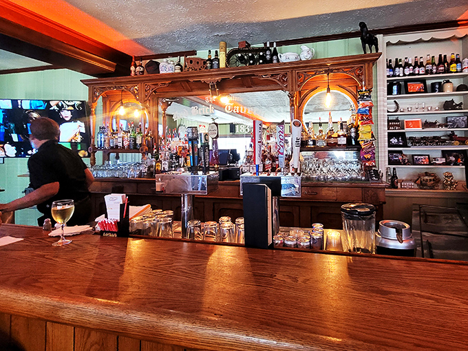 Behind this magnificent wooden bar, spirits have been poured for generations of weary travelers, celebrating milestones or simply Tuesday evenings.