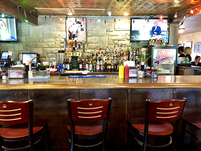 The bar at Woody's—where strangers become friends and friends become family over shared stories and cold beverages.