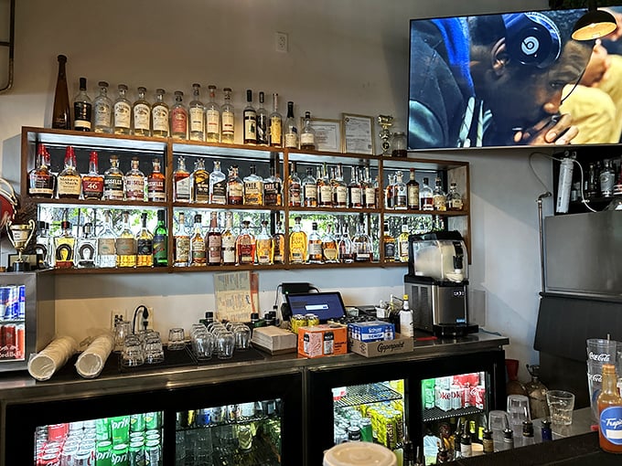 A bar stocked better than most people's retirement portfolios. Bourbon and BBQ—a pairing as timeless as Sinatra and a good suit.
