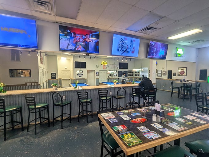 The bar area serves as command central—where cold beers are poured, sports are watched, and the day's gossip is exchanged like currency.