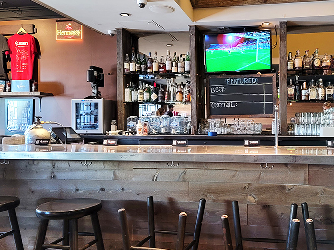 The bar area proves that great BBQ deserves great drinks. This isn't just dinner; it's a full sensory experience with sports on the side.
