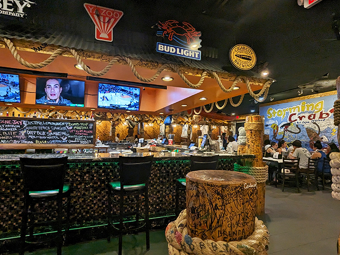 The bar area glows with neon promise. Those TVs aren't the main attraction—they're just something to glance at between bites.