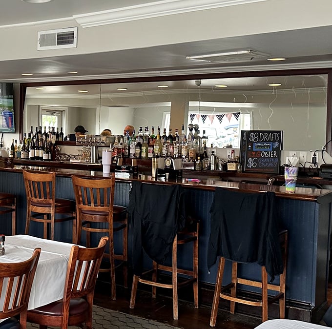 A well-stocked bar ready to pour liquid accompaniments for your seafood feast. The perfect place to debate the merits of beer versus Orange Crush.