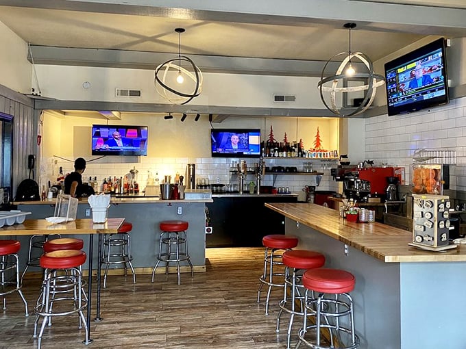 The bar area—where strangers become friends and friends become regulars, all under the warm glow of globe pendant lights.