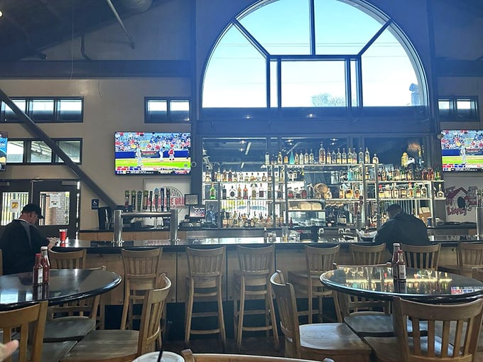 The bar area – where strangers become friends over cold beers and heated debates about the best BBQ sauce.