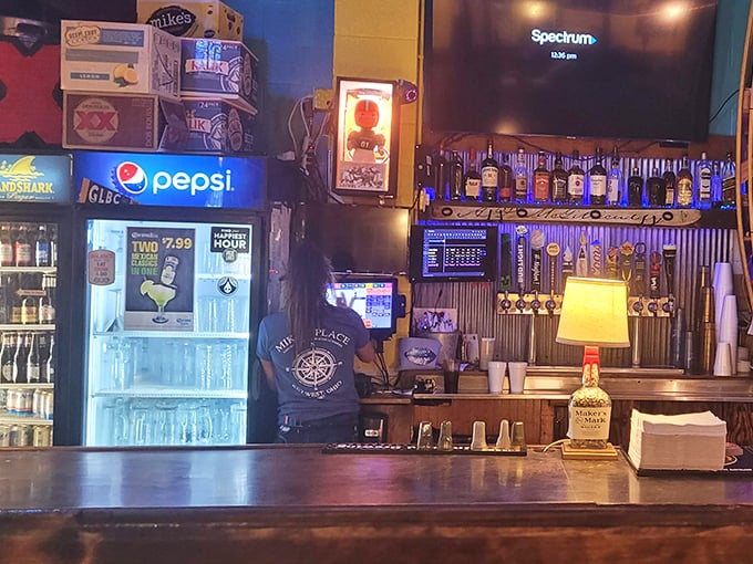 The bar at Mike's doesn't just serve drinks—it serves history. Those bottles stand at attention like soldiers guarding liquid happiness. 