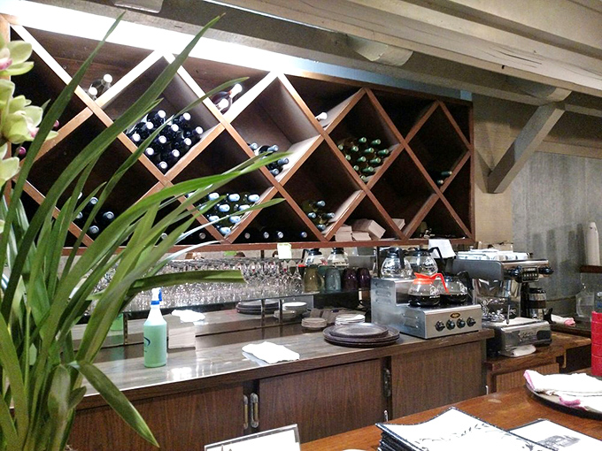 The bar area with its impressive wine rack suggests Kathleen's isn't just a breakfast affair—evening delights await the dinner crowd too.