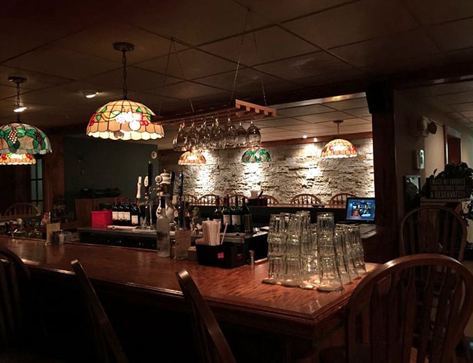 This isn't just a bar—it's a stage where liquid happiness is crafted beneath the glow of stained glass lamps and stone walls.