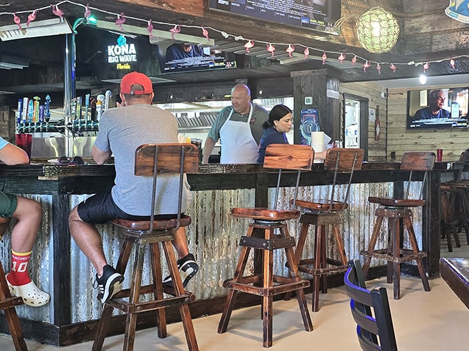The bar—where strangers become friends and locals share their island secrets. Those wooden stools have supported countless happy hours and fishing tales.