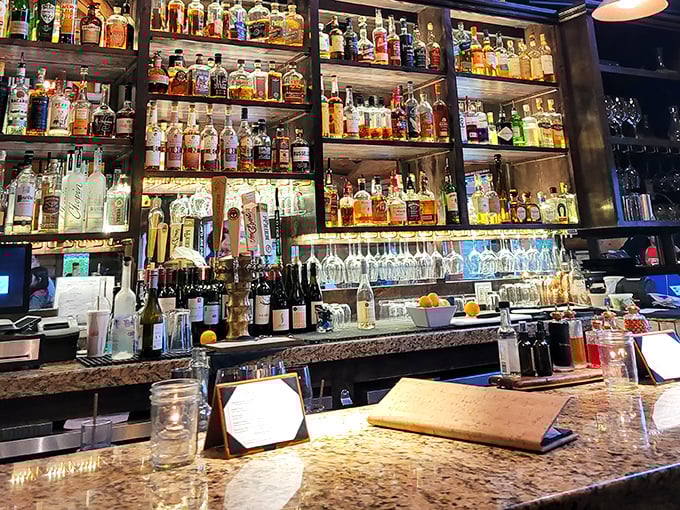A bar stocked so thoroughly it looks like it's preparing for prohibition's return. Whatever your spirit of choice, they've got you covered – probably twice.