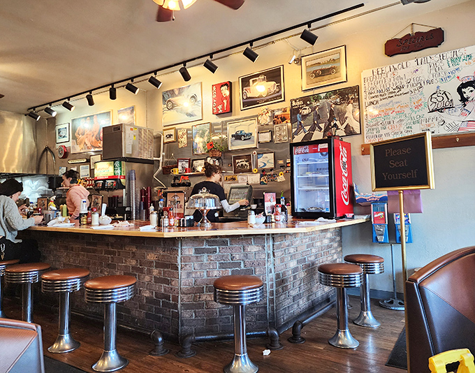 The counter—where solo diners find community, watching short-order ballet while perched on stools that have heard it all.