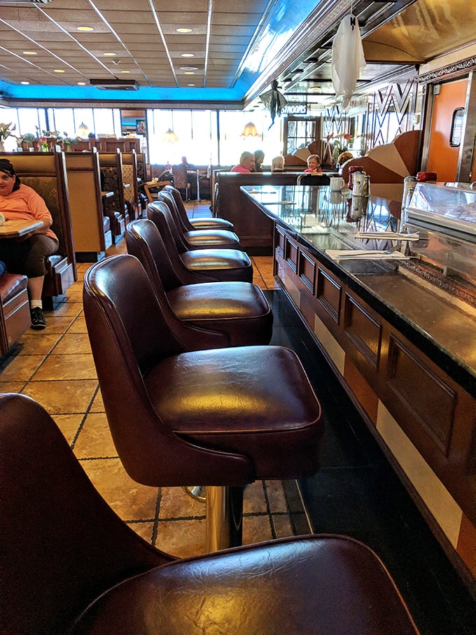The counter seats—where solo diners become temporary family and the short-order ballet unfolds before your appreciative eyes.