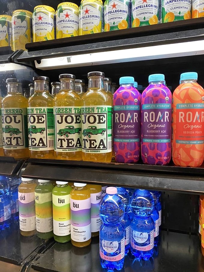 The beverage case is a liquid rainbow of options. Joe Tea and ROAR—even the drink names sound like they're having more fun than we are.