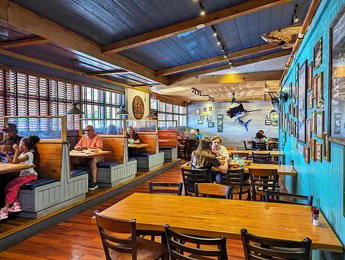 This cozy corner with fishing photos feels like your favorite uncle's beach house—if your uncle were a world-class seafood chef.