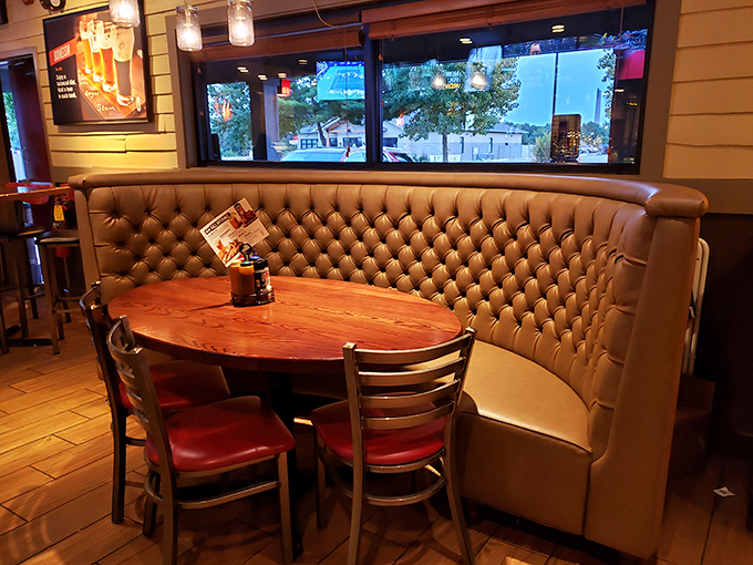 That booth isn't just seating—it's a tufted leather throne from which to command your barbecue feast in cushioned comfort.