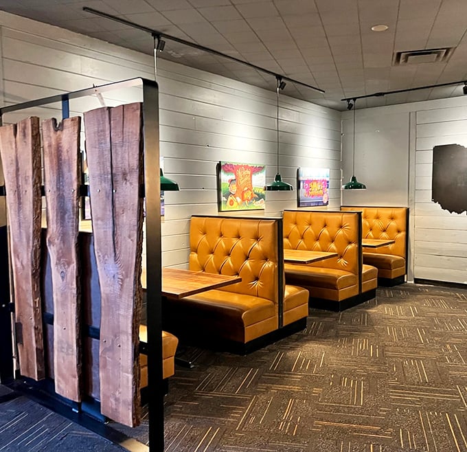 These honey-colored booths aren't just seating – they're invitation-only clubs where the membership fee is a hearty appetite.