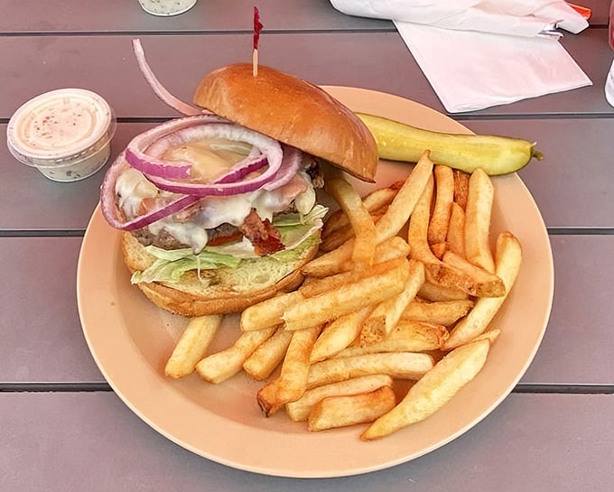 A burger that requires both hands and several napkins—the universal sign of something worth the mess.