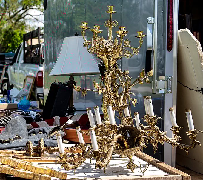 A gold chandelier that's either gloriously gaudy or absolutely magnificent—sometimes the line between tacky and treasure is delightfully thin.