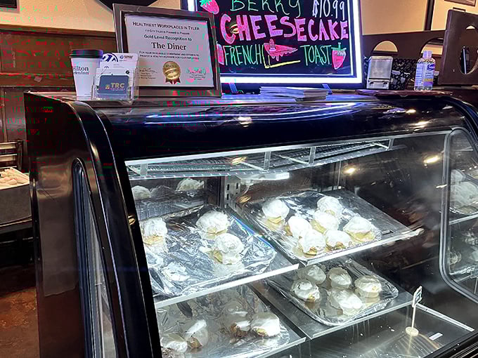 Fresh cheesecakes displayed like edible artwork, tempting diners to save room for one more indulgence.