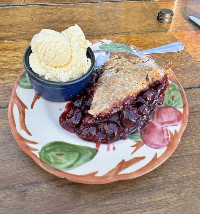 Cherry pie that captures Michigan's soul on a plate. That scoop of vanilla ice cream isn't melting—it's swooning in the presence of greatness.