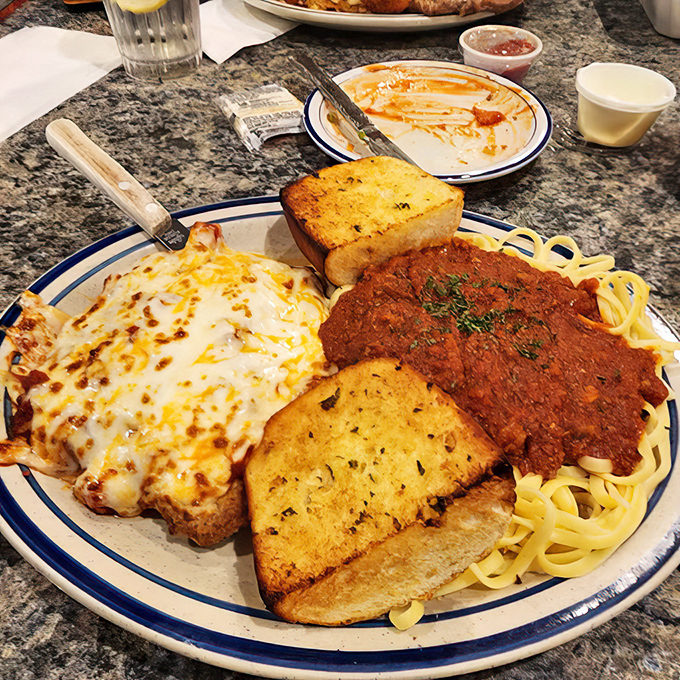 Italian-American comfort on a plate! Spaghetti, garlic bread, and chicken parmesan—the holy trinity of satisfying dinners that feed both body and soul.