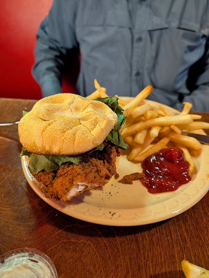 This isn't just a chicken sandwich – it's comfort food architecture with crispy coating, fresh greens, and a bun that knows its supporting role.