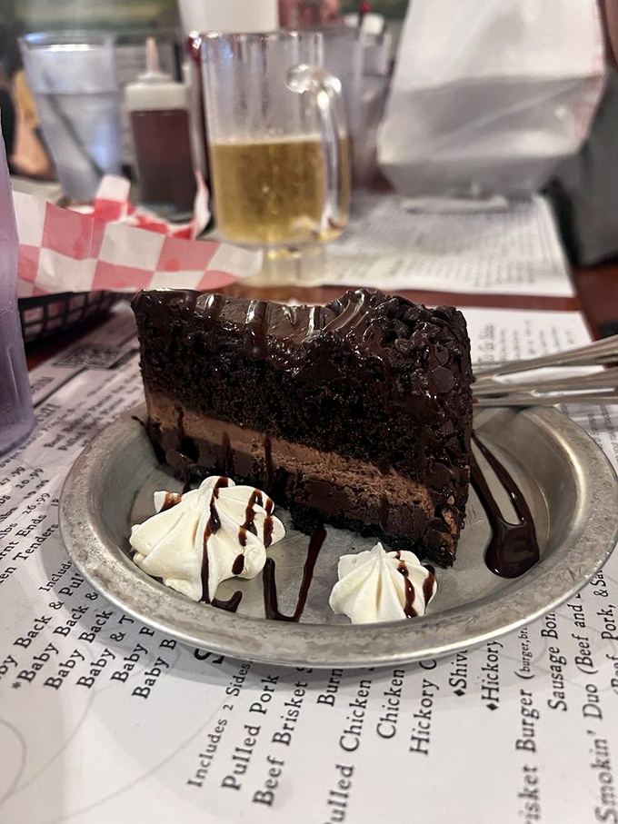 This chocolate cake isn't just dessert—it's a towering monument to cocoa that demands respect and stretchy pants.