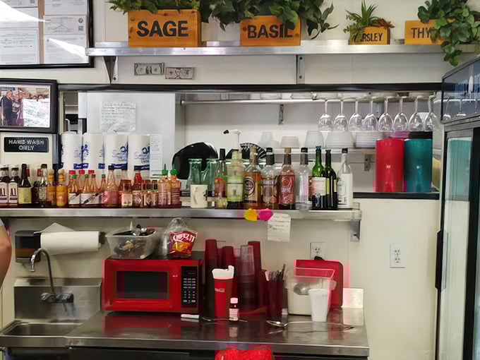 The condiment station—unsung hero of diner cuisine. Those humble bottles hold the power to transform good meals into unforgettable ones.